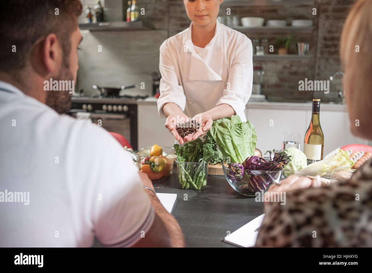 Group of people taking cooking course Stock Photo - Alamy