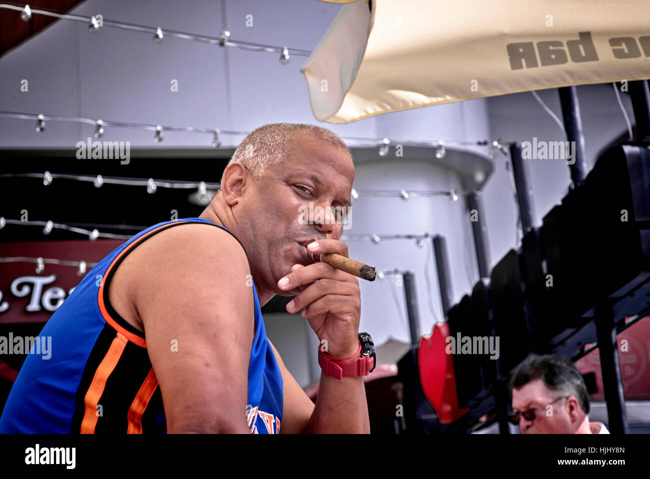 Man smoking large Cuban cigar Stock Photo - Alamy