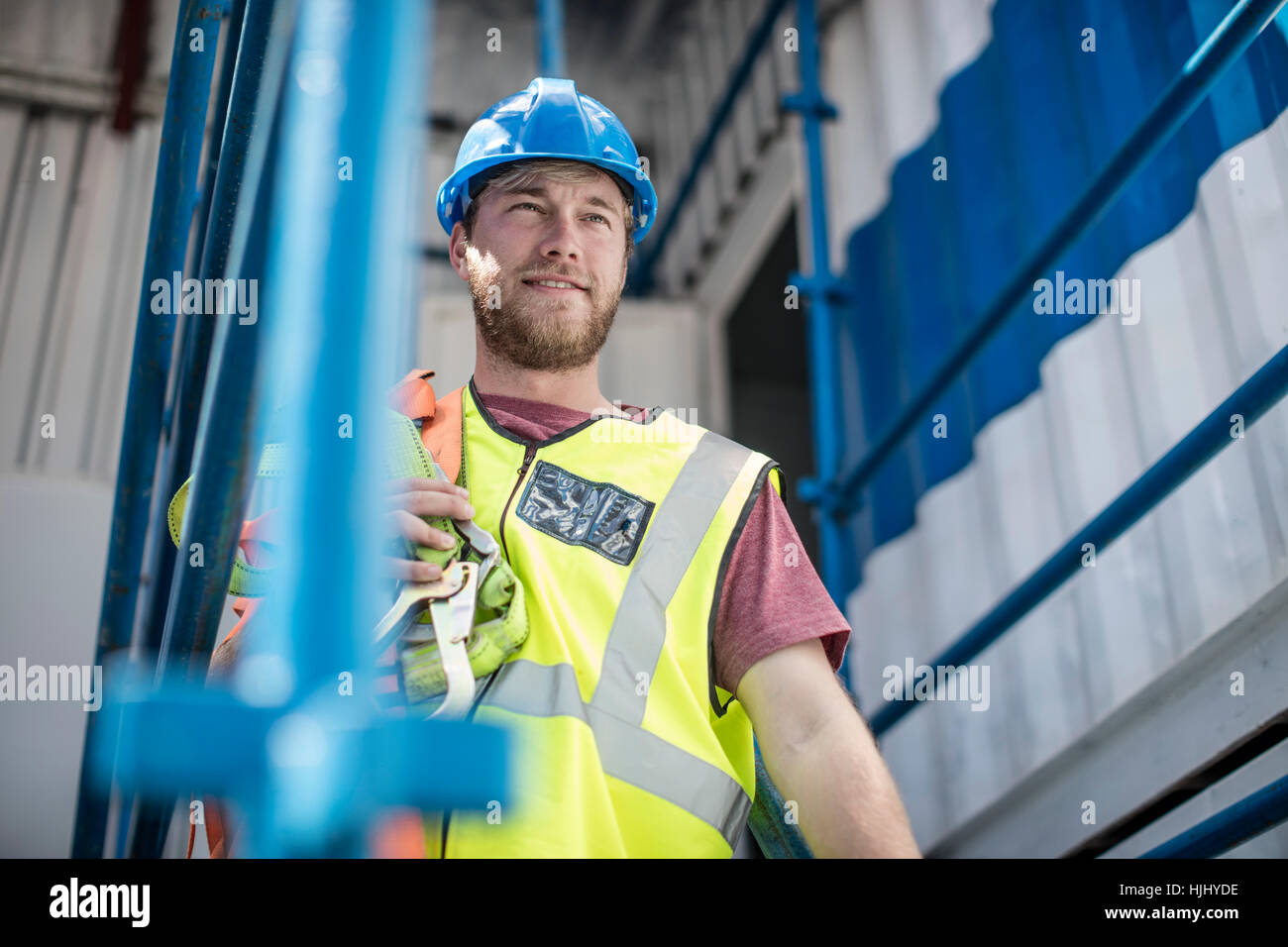 Construction worker on construction site wearing safety vest Stock ...