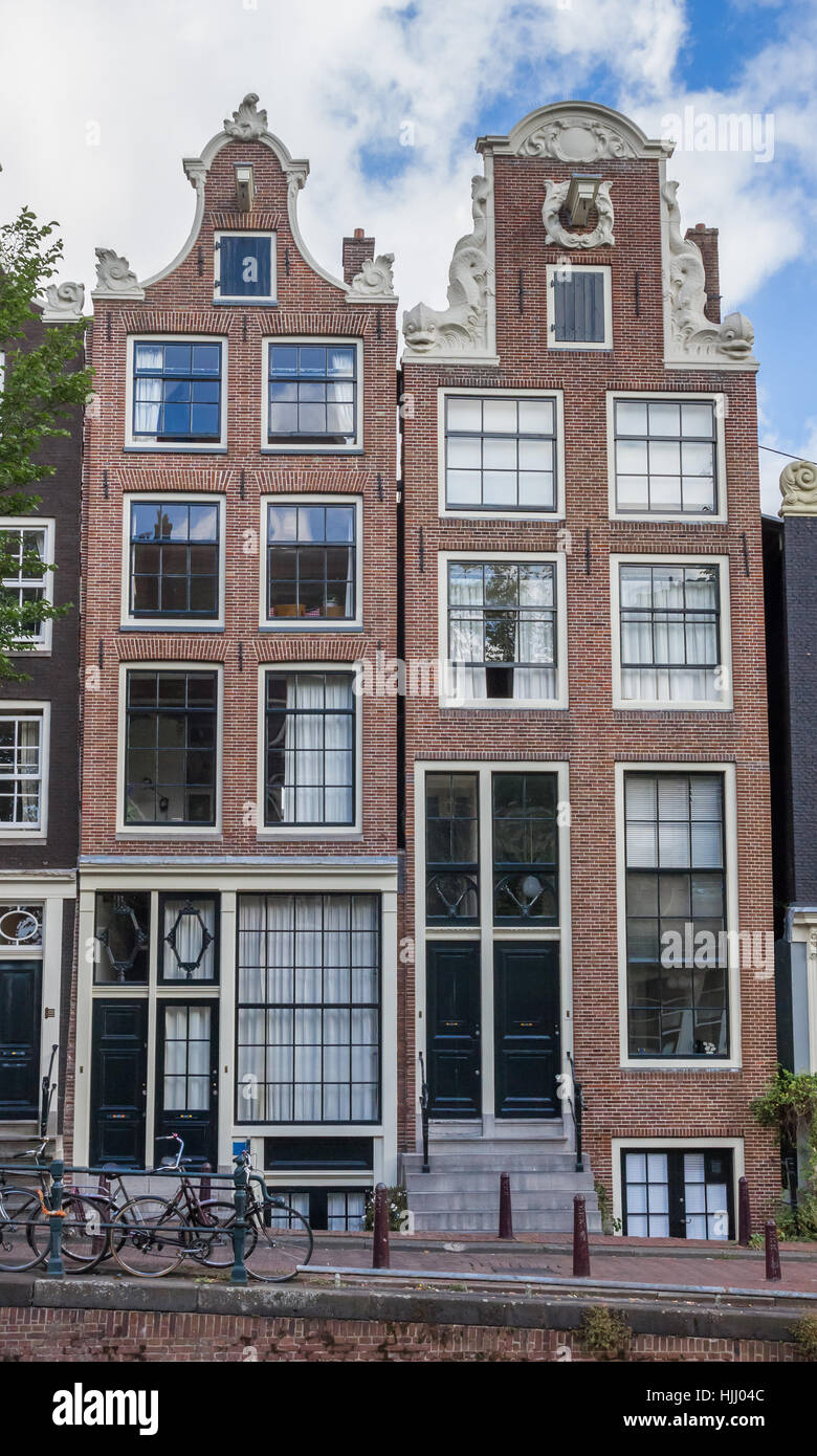 Historical houses at a canal in Amsterdam, The Netherlands Stock Photo ...