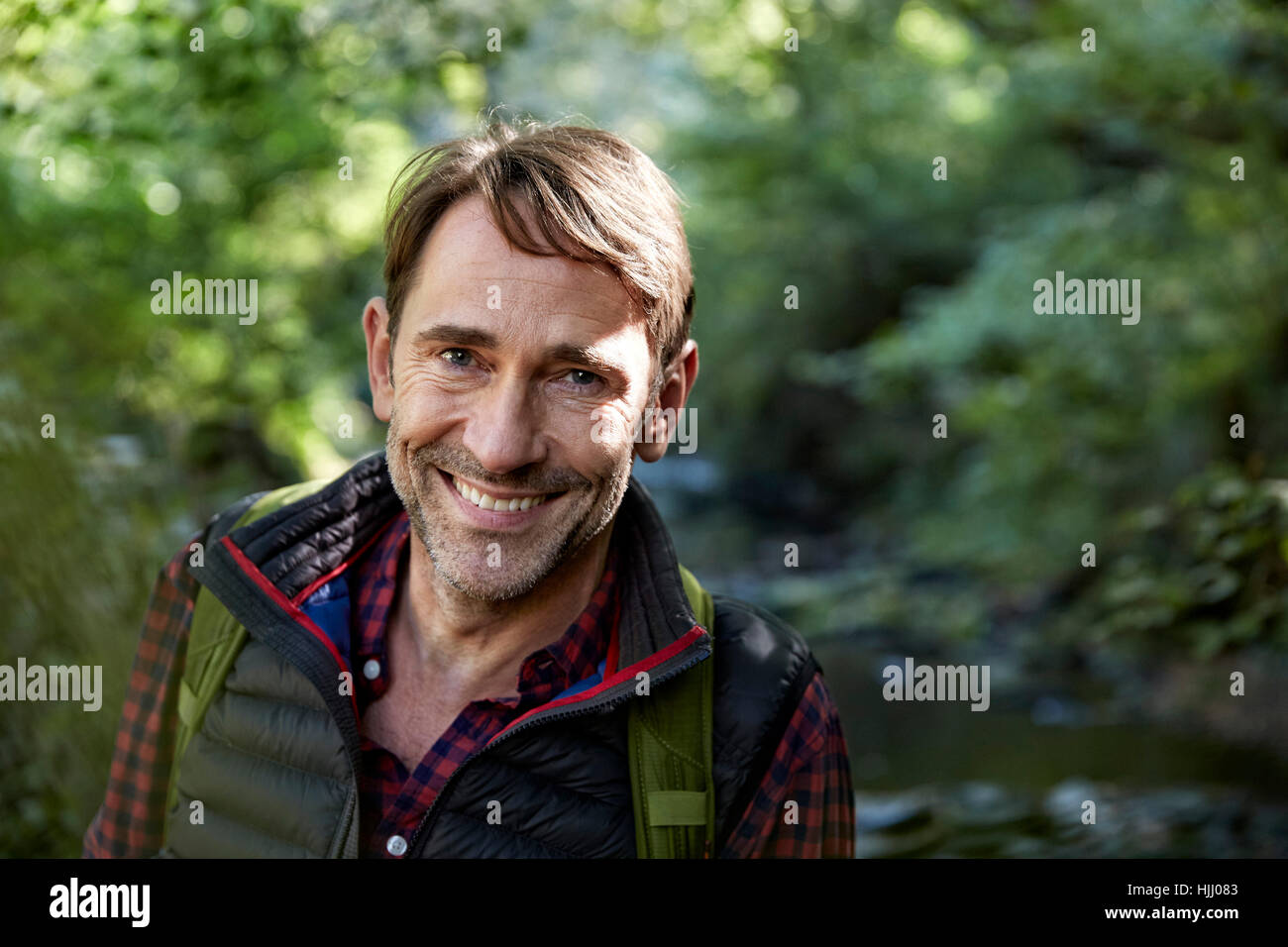 Hiker in forest, portrait Stock Photo - Alamy