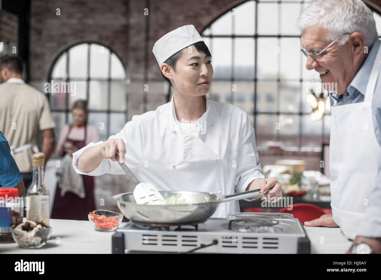 Senior man taking a cooking course Stock Photo - Alamy