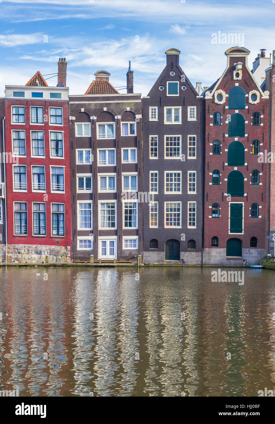 Colorful houses at the Damrak in Amsterdam, Holland Stock Photo - Alamy