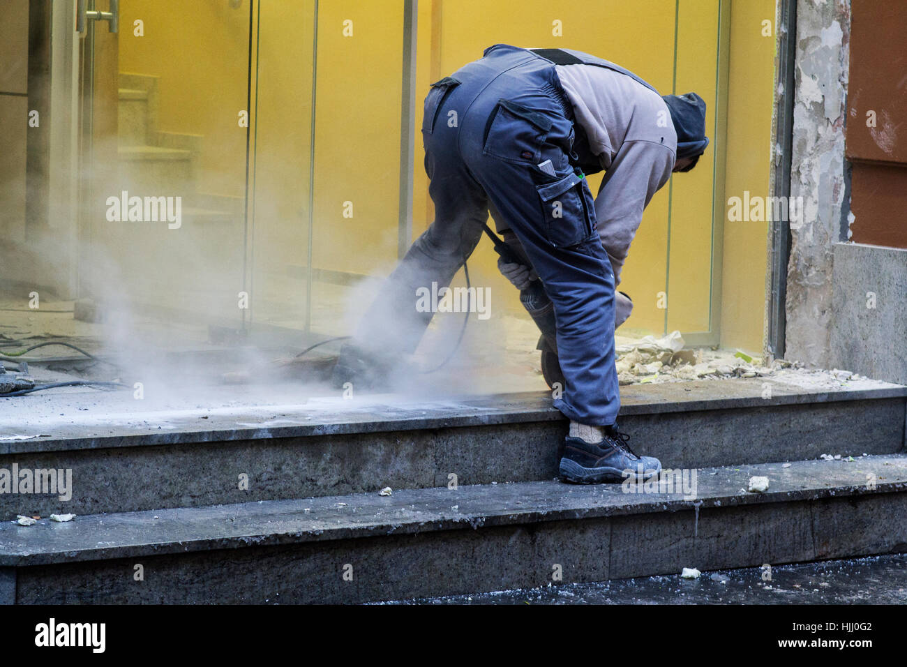 Man working on tool's Stock Photo - Alamy