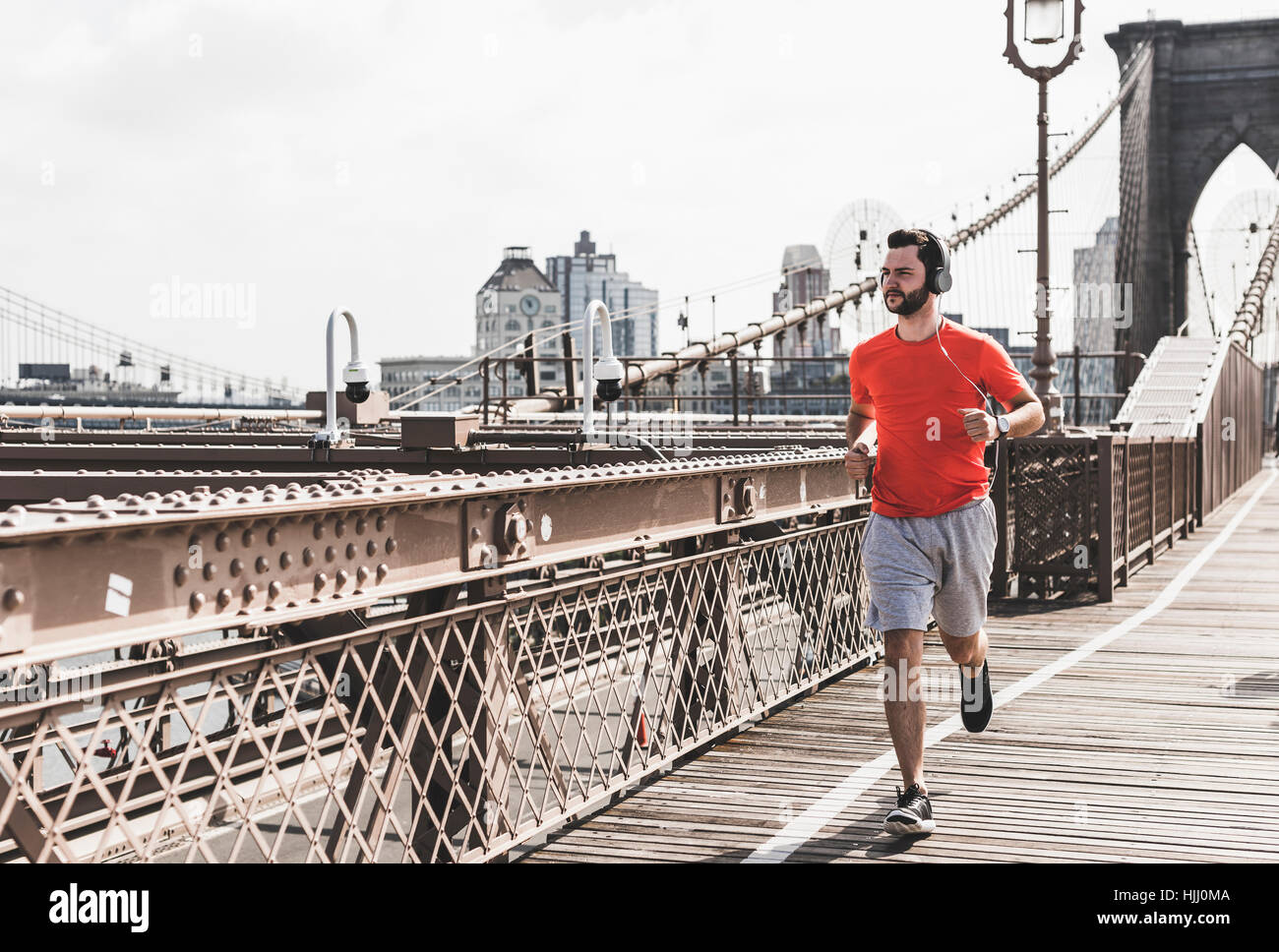 USA, New York City, man running on Brooklyn Brige Stock Photo - Alamy