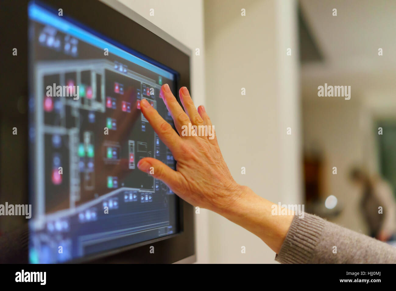 Senior woman's hand touching display panel of domestic technology Stock ...