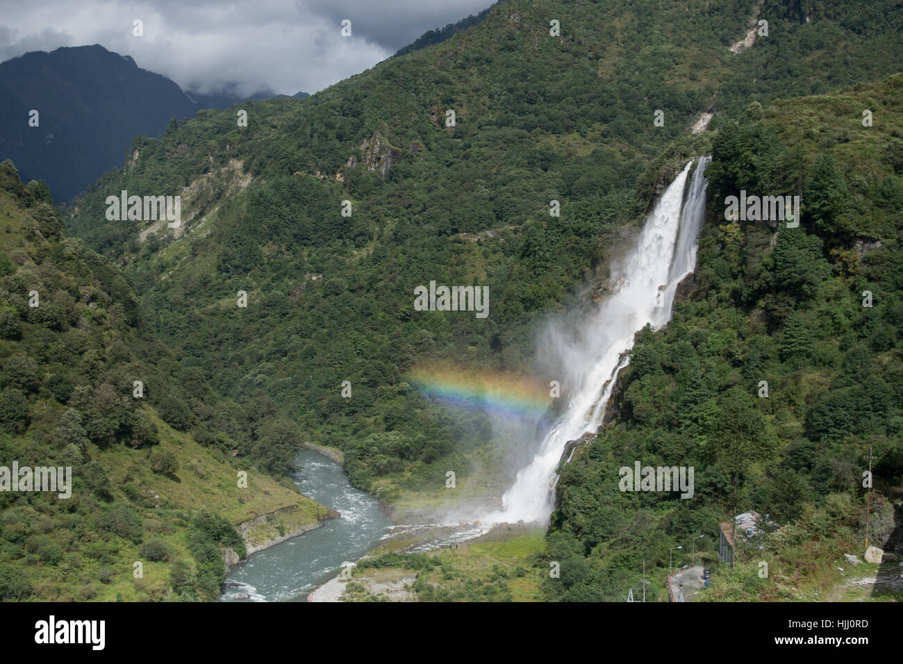 Waterfall with rainbow in the Himalayas Stock Photo - Alamy