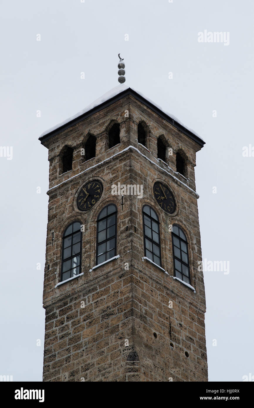 Clock tower with windows covered in snow Stock Photo - Alamy