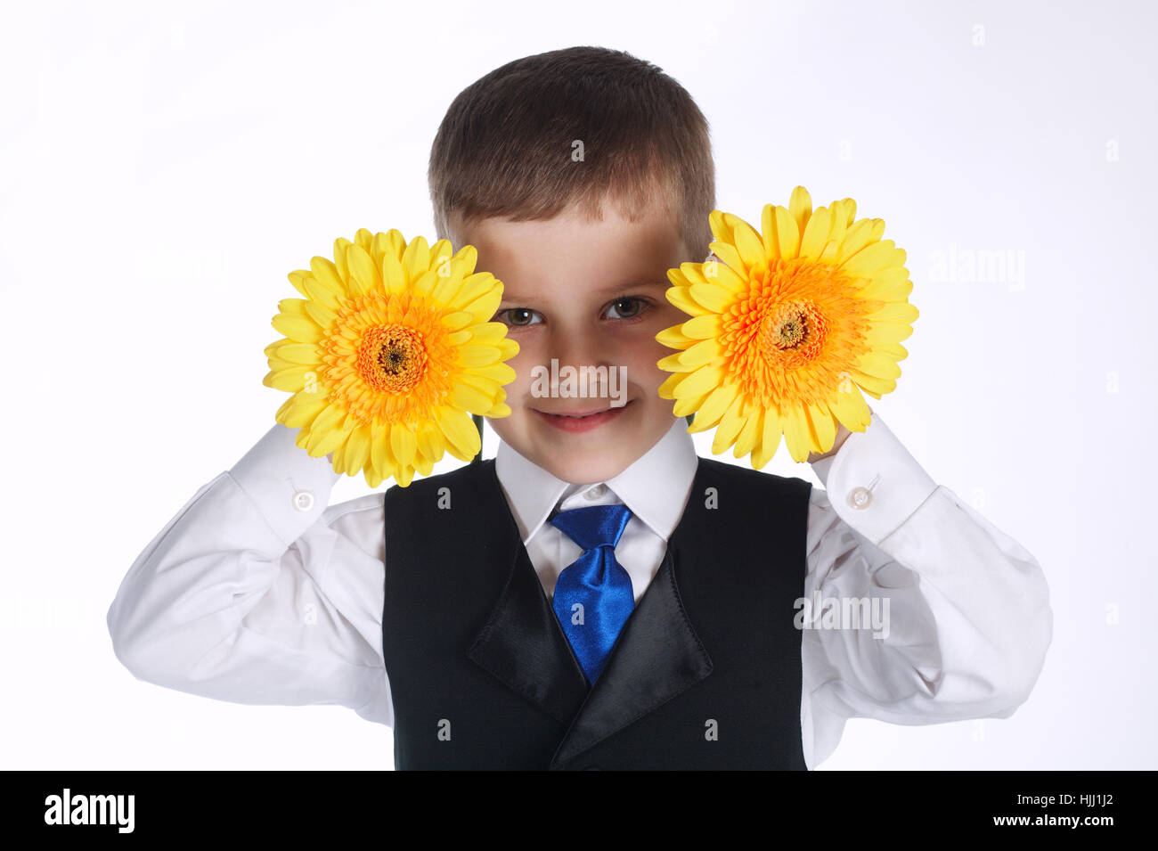 happy boy with yellow flowers Stock Photo - Alamy