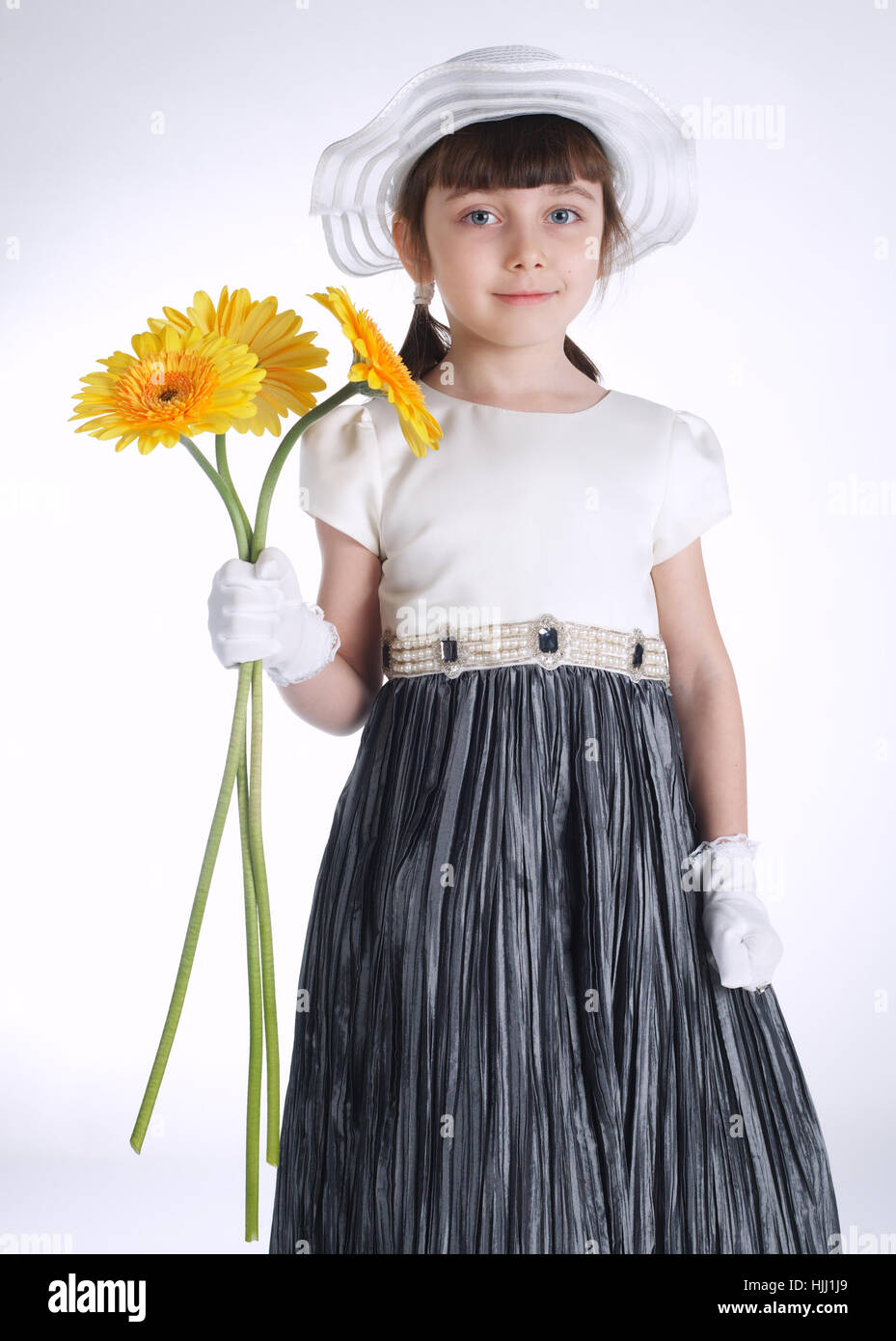 happy girl with yellow flowers Stock Photo - Alamy