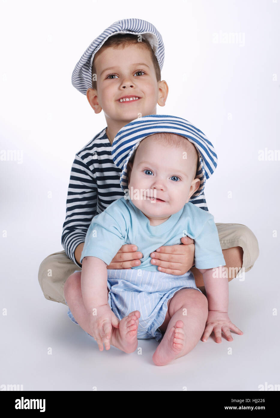 two happy brothers on white background Stock Photo - Alamy