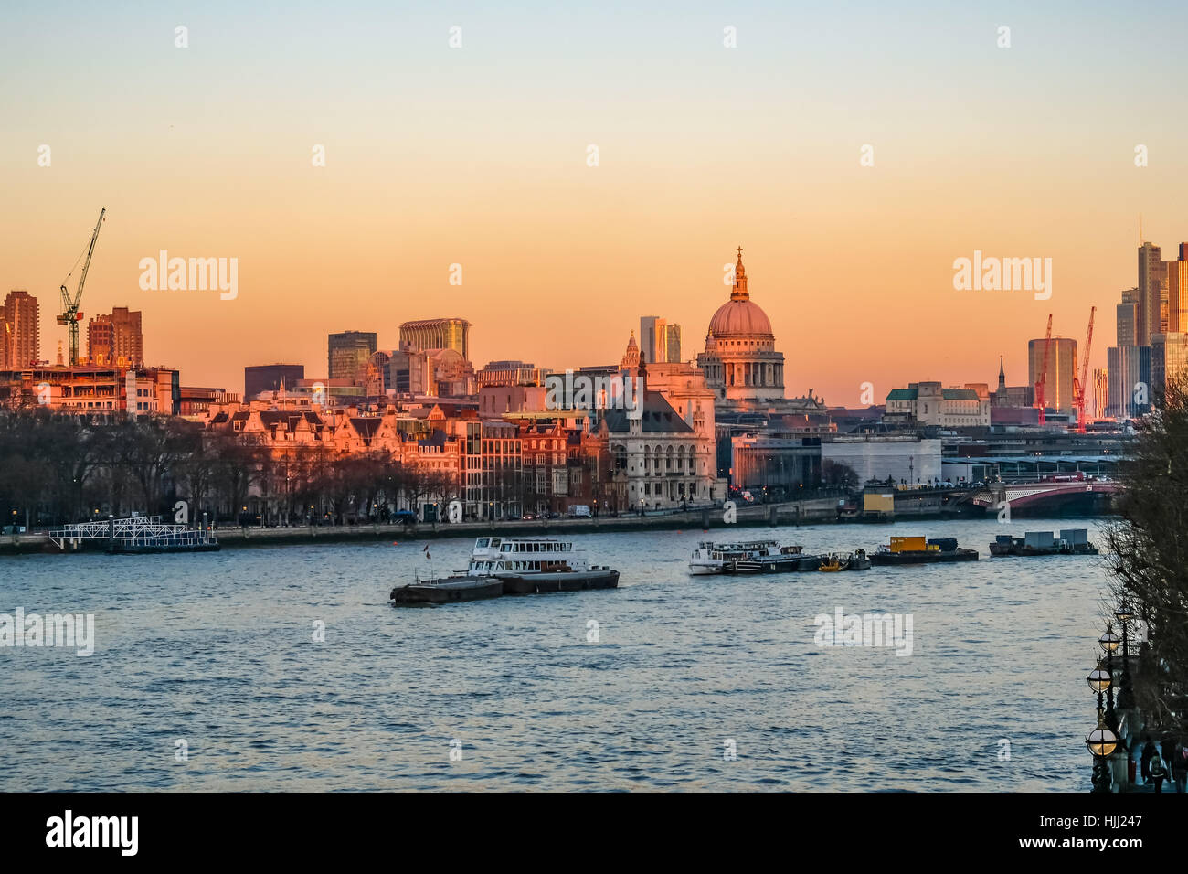 London skyline at sunset. Bright winter's afternoon sunset showing St ...