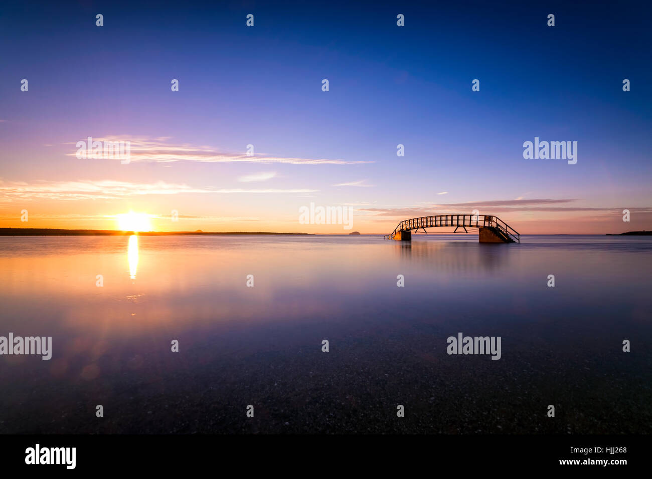 Scotland, East Lothian, Dunbar, submerged Belhaven Bridge at sunset ...