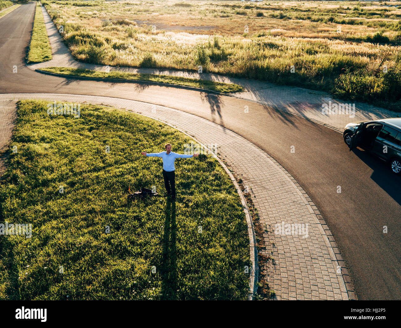 Man alone on roundabout hi-res stock photography and images - Alamy