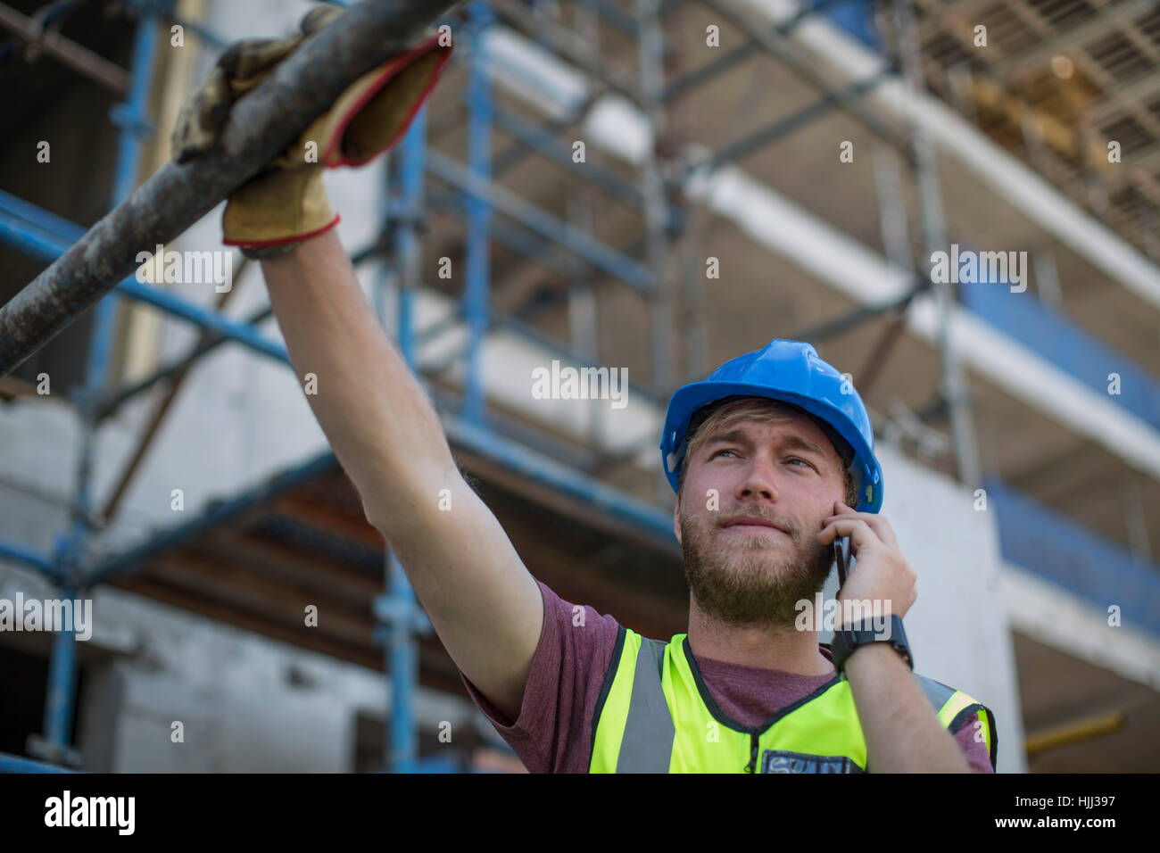 Construction worker on construction site talking on the phone Stock ...