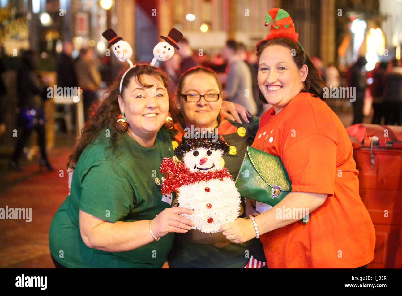 Christmas revellers festive spirit enjoy hi-res stock photography and ...