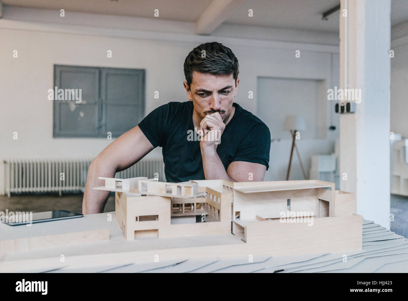 Architect looking at architectural model Stock Photo - Alamy