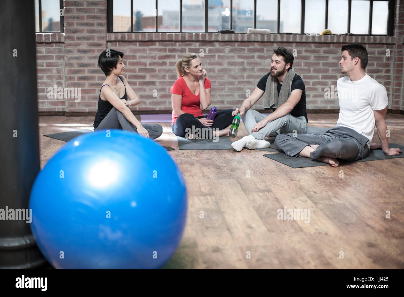 Group of people in yoga class studio Stock Photo - Alamy