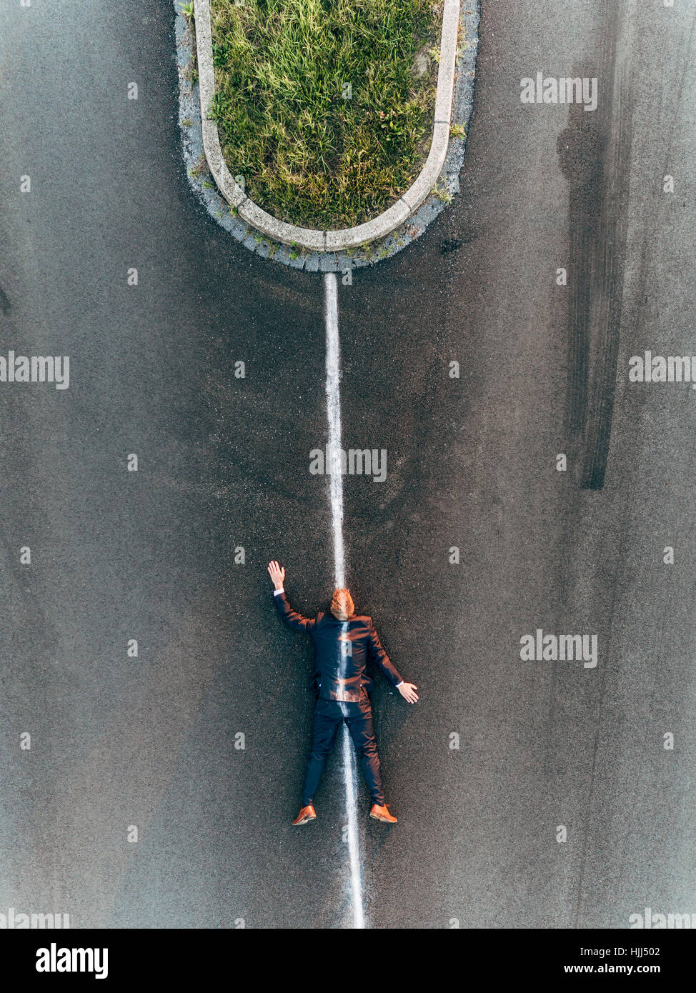 Run over man lying on road Stock Photo - Alamy