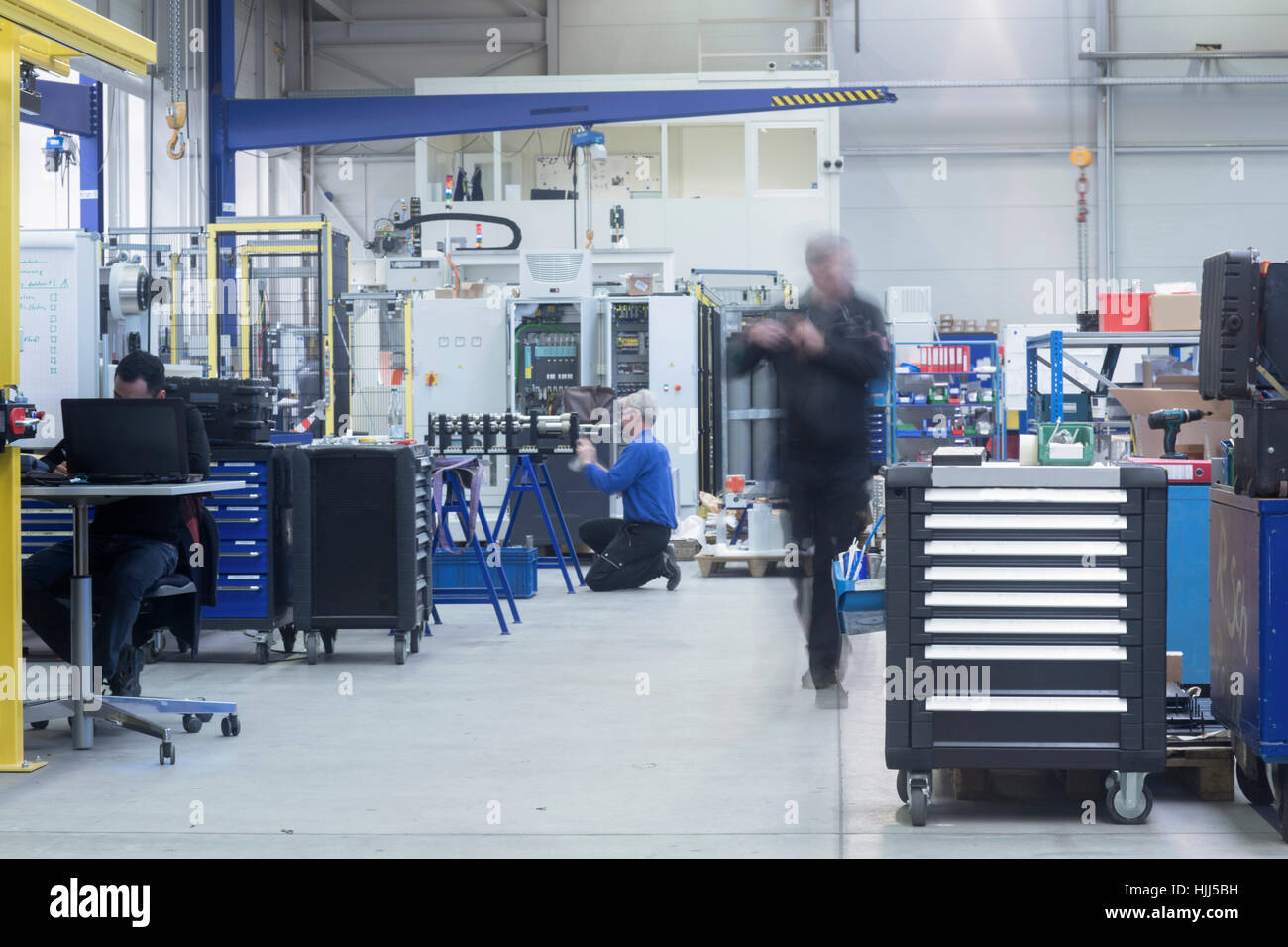 People at work in a factory Stock Photo - Alamy