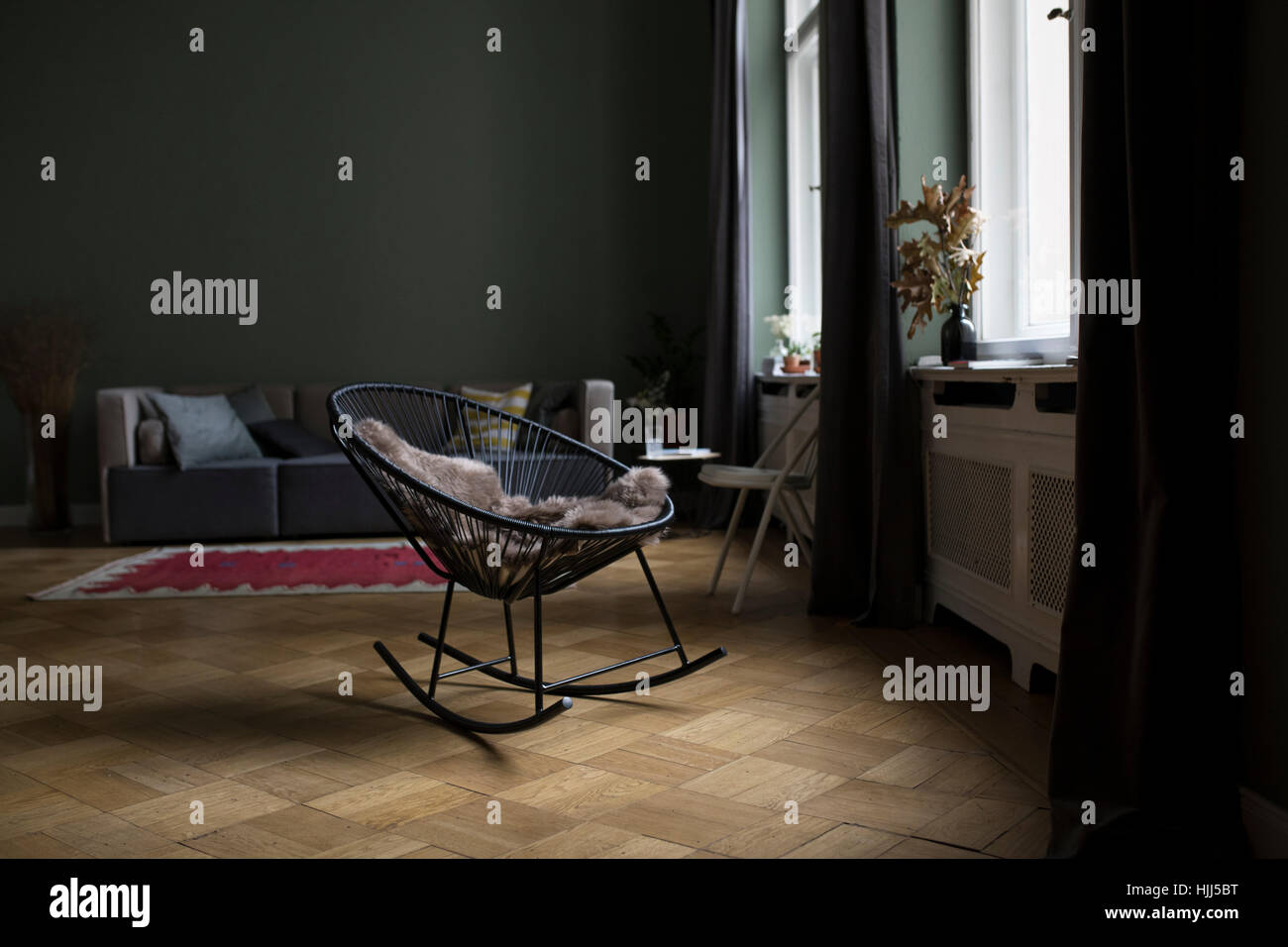 Rocking chair in a modern living room Stock Photo - Alamy