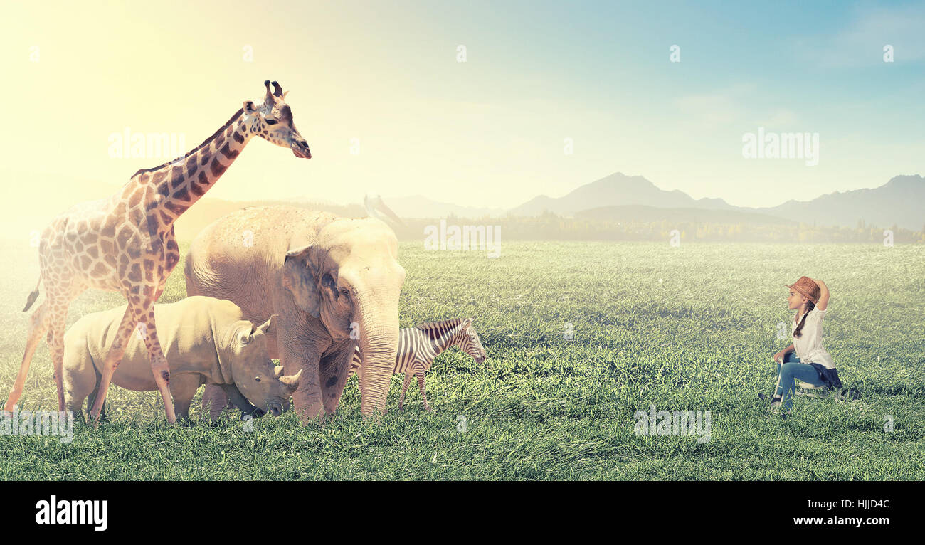 Cute school girl outdoor with wild animals Stock Photo - Alamy