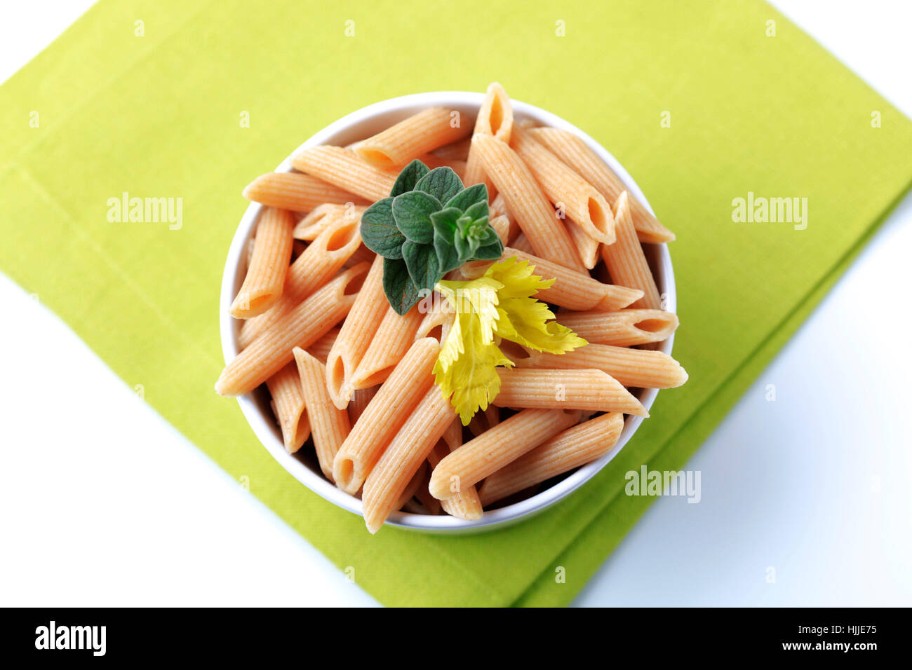 Bowl of whole wheat pasta tubes - overhead Stock Photo - Alamy