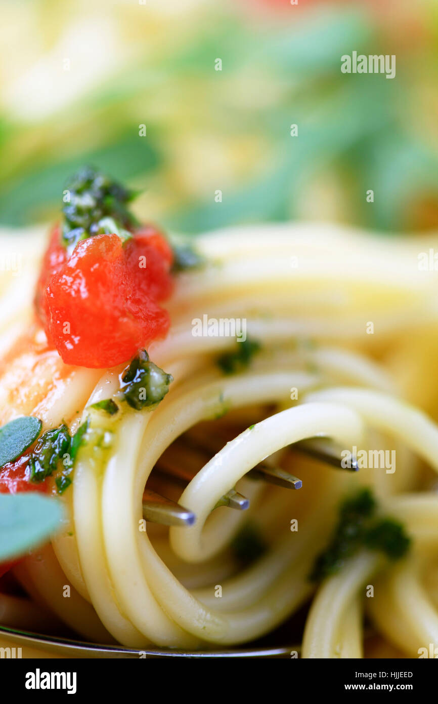 Macro shot of spaghetti twirled around a fork Stock Photo - Alamy