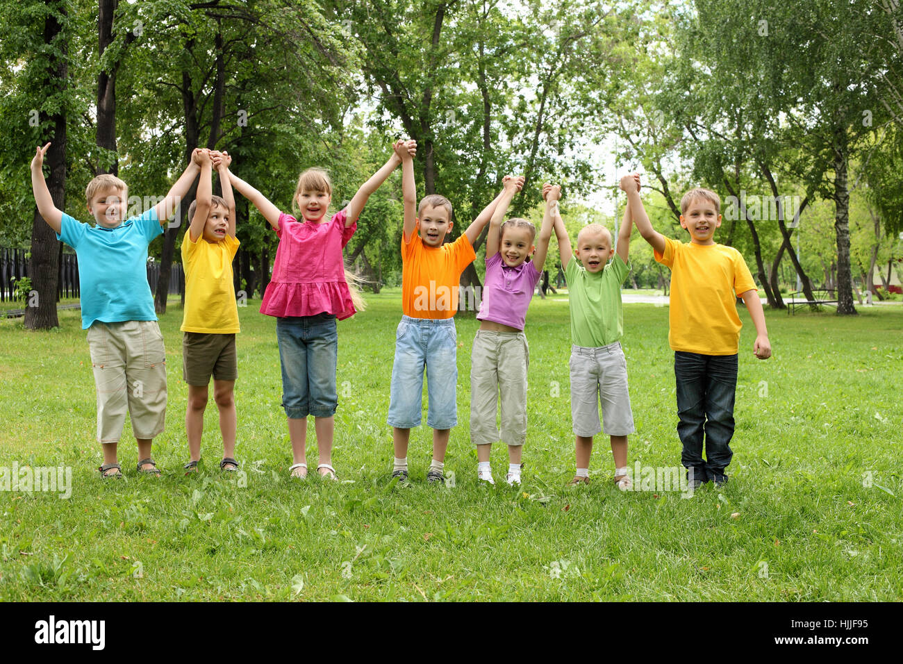 Group of children having fun together in the park Stock Photo - Alamy