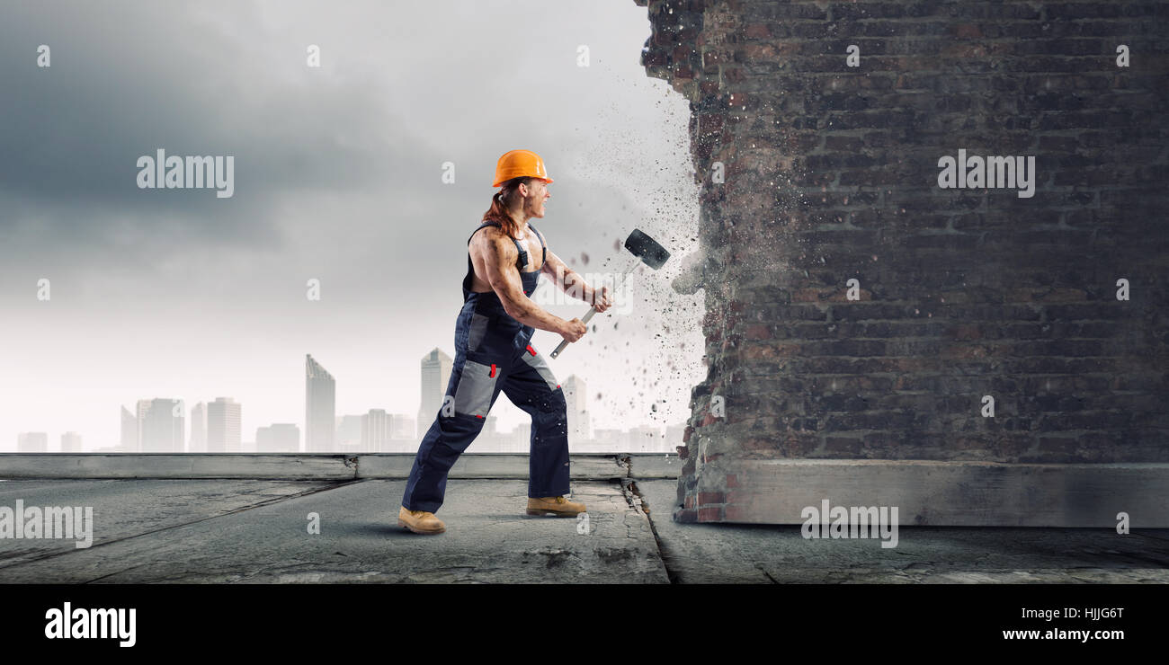 Man break brick wall in hi-res stock photography and images - Alamy