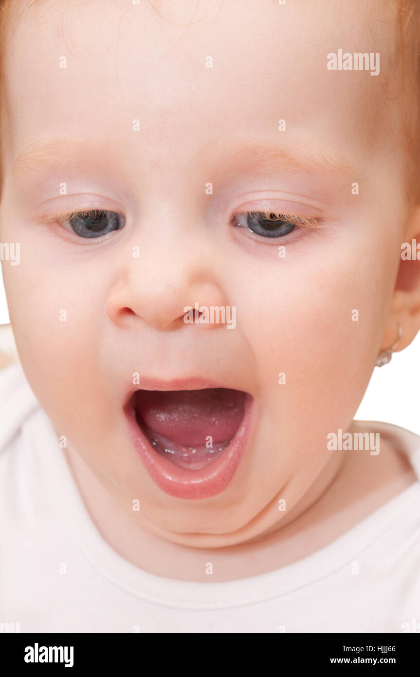 Closeup yawning baby girl face hi-res stock photography and images - Alamy