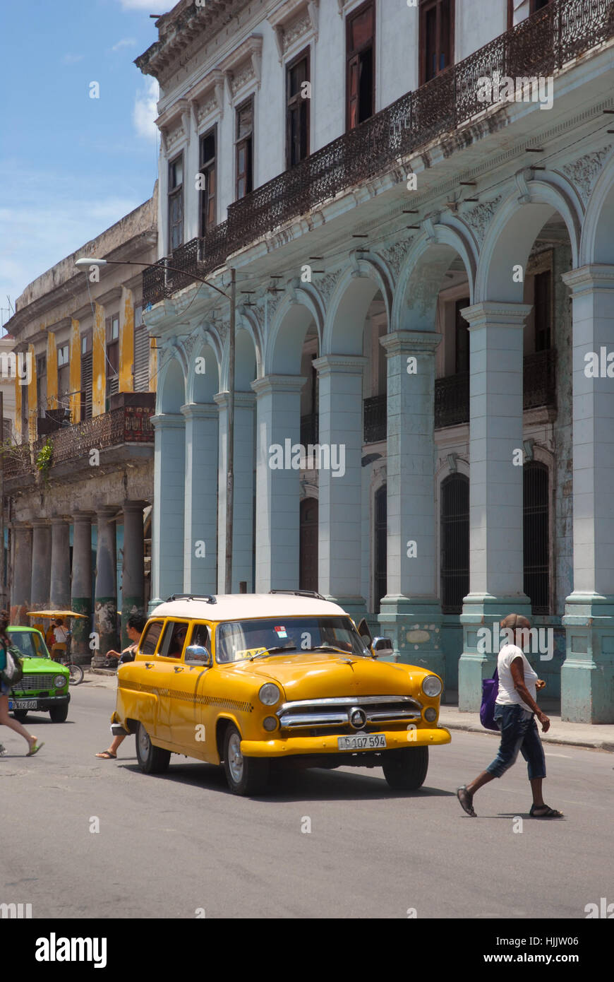 Yellow vintage car on the streets of Havana, Havana, Cuba Stock Photo ...