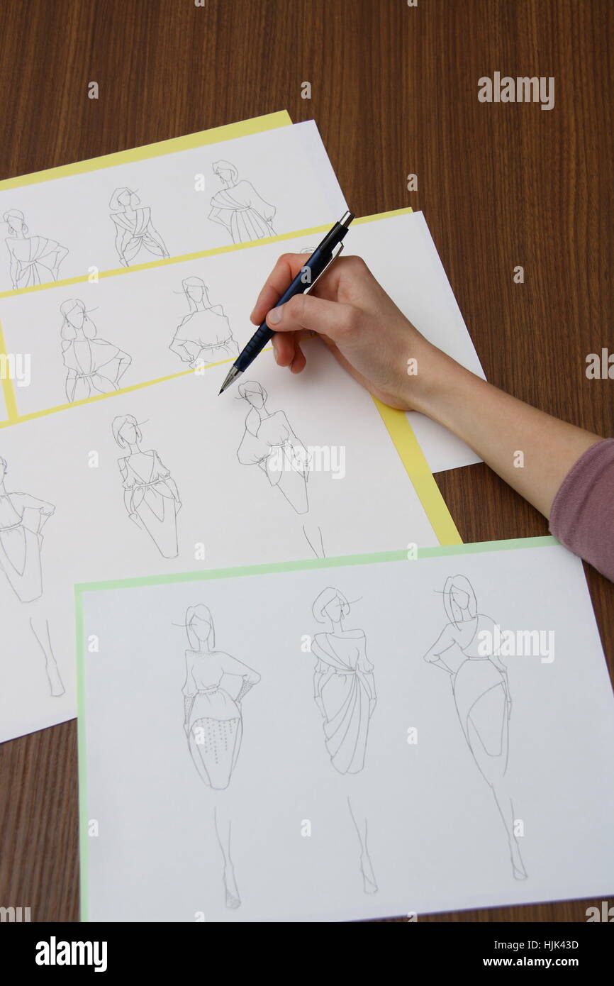designer assessing fashion drawings on the collection of clothes Stock ...