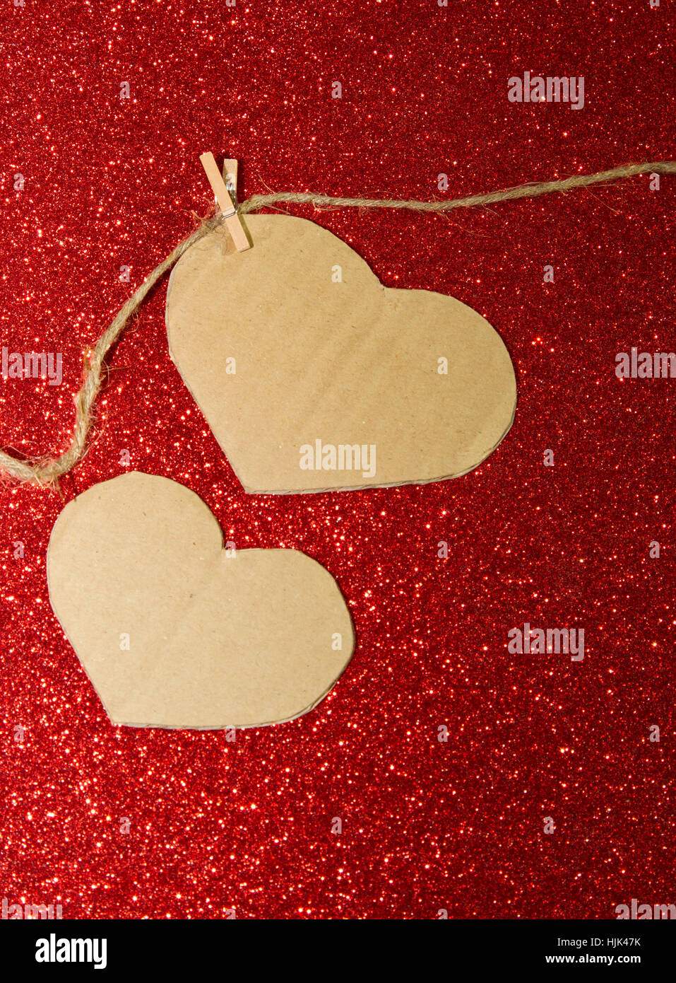 Two carton hearts on the red shining background Stock Photo - Alamy