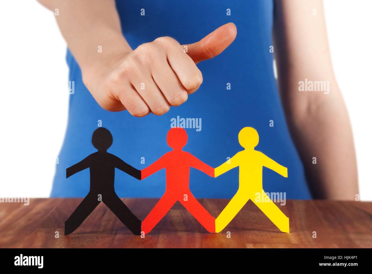 a hand shows thumbs up next to a colorful paper chain family, isolated ...