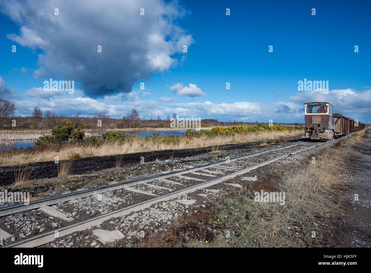 Bog train of West Offaly Railway filled with peat on the way to power ...