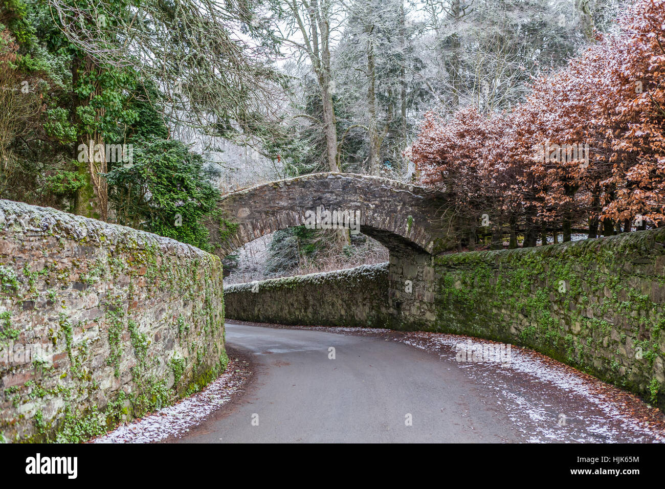 An old stone bridge crosses the road near Glen Tilt, Perthshire ...