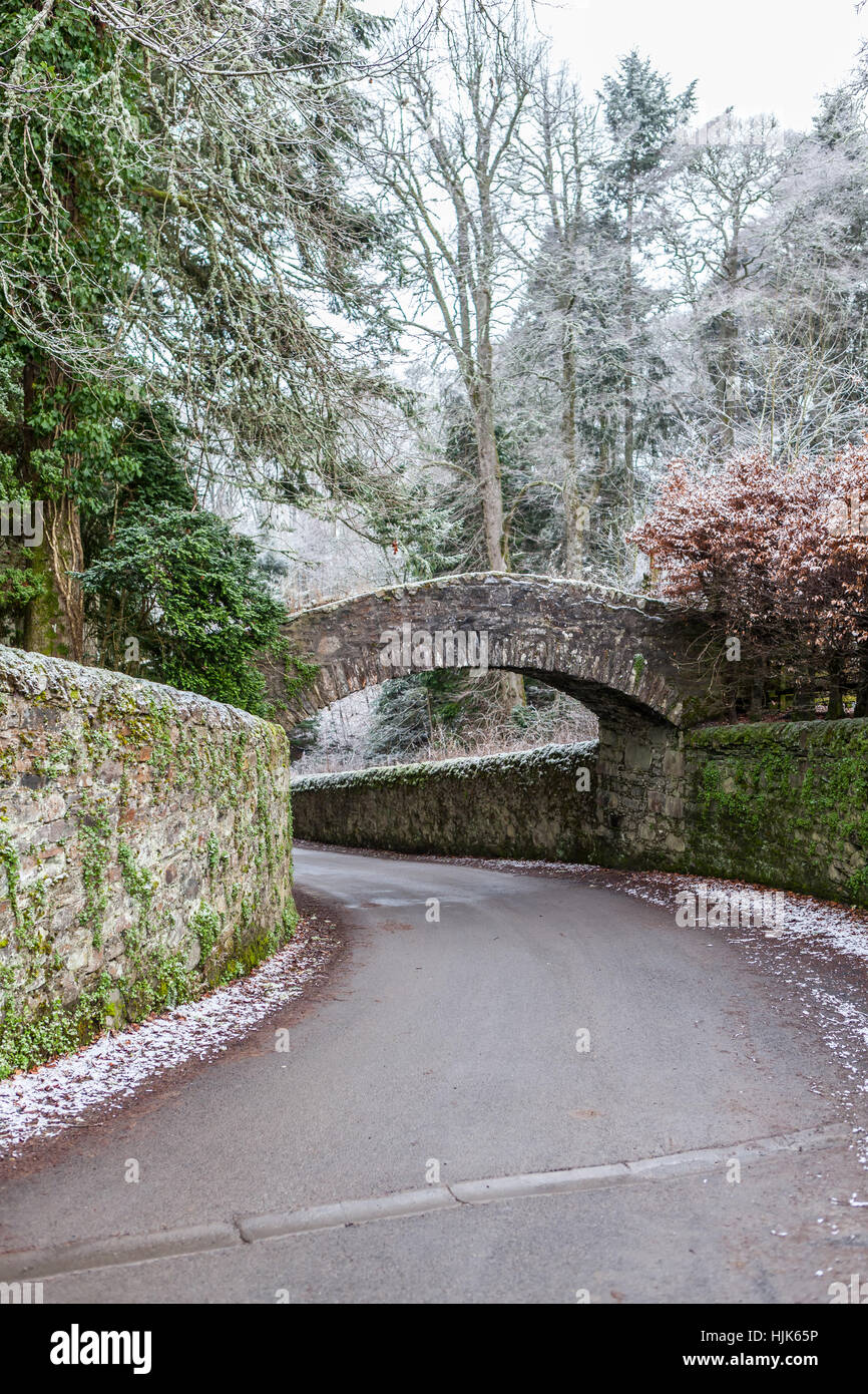 An old stone bridge crosses the road near Glen Tilt, Perthshire ...