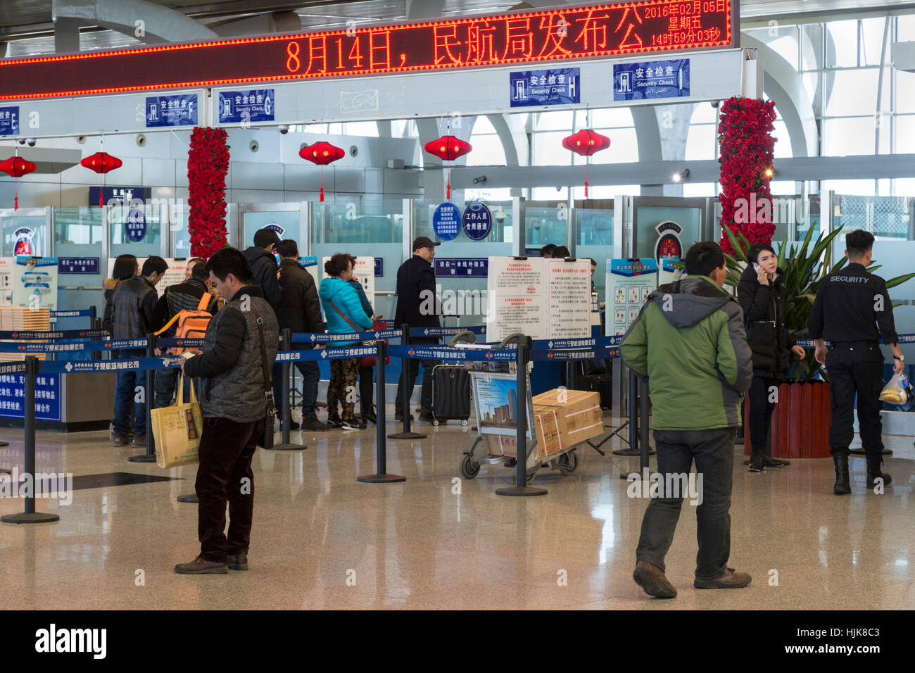 Check-in desks and passengers at Yinchuan Hedong International Airport ...
