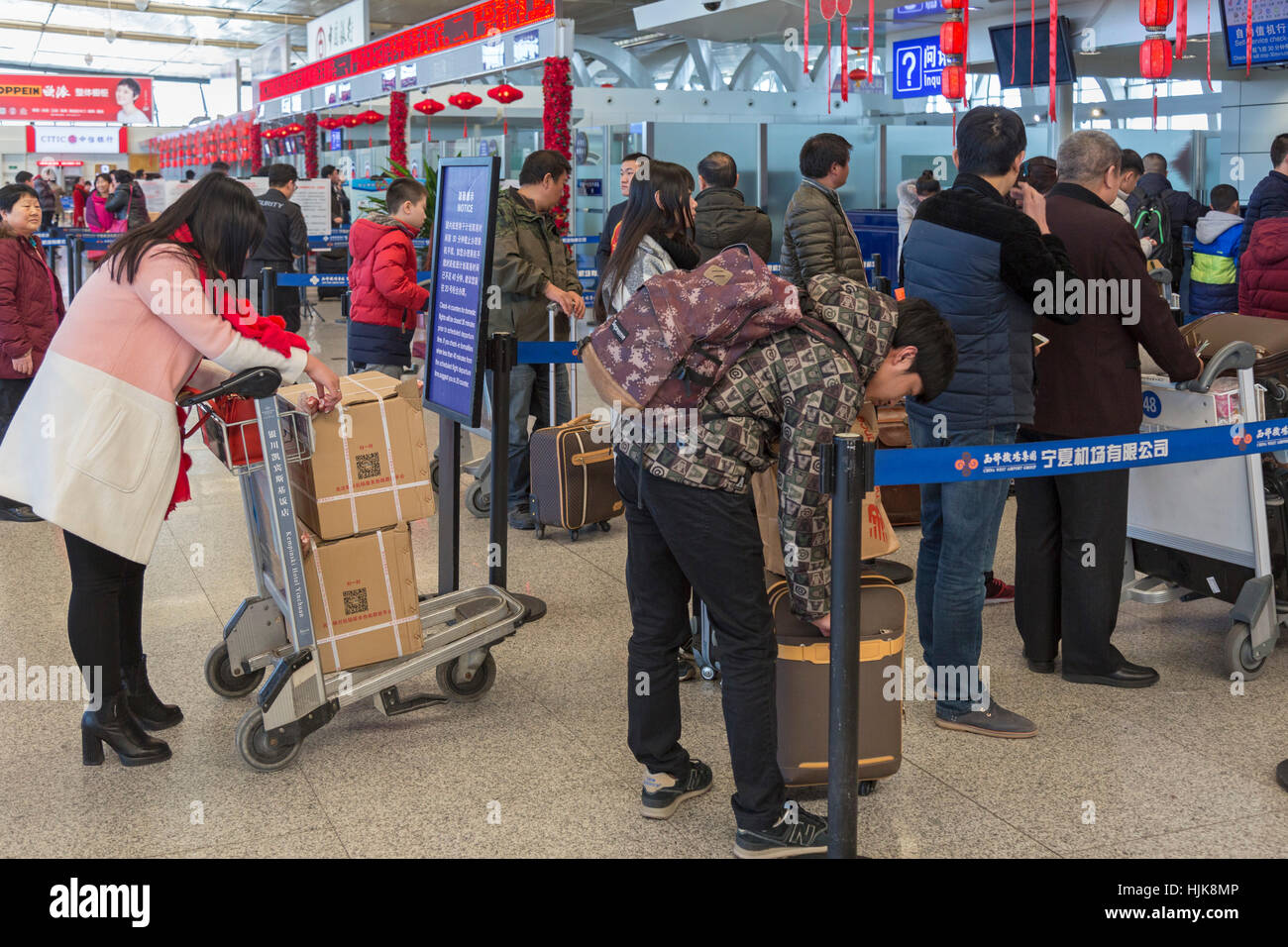 Passengers at check-in desk at Yinchuan Hedong International Airport ...