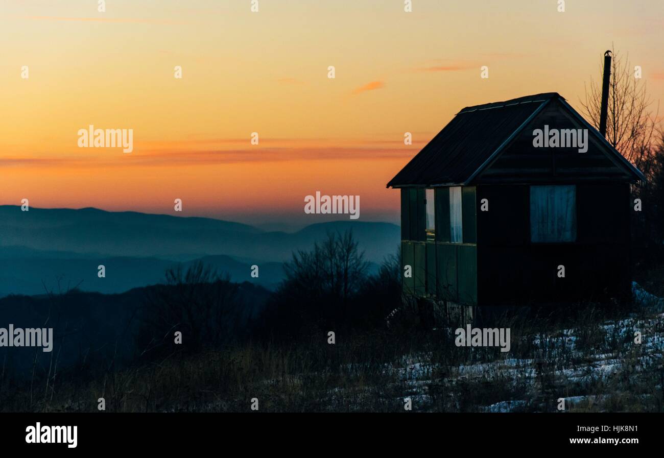 House in mountains with sunset Stock Photo - Alamy