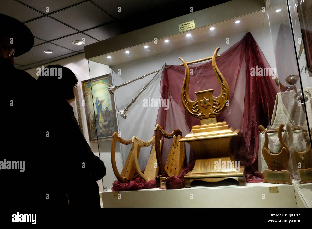 Visitors view musical instruments displayed at the Temple Institute ...