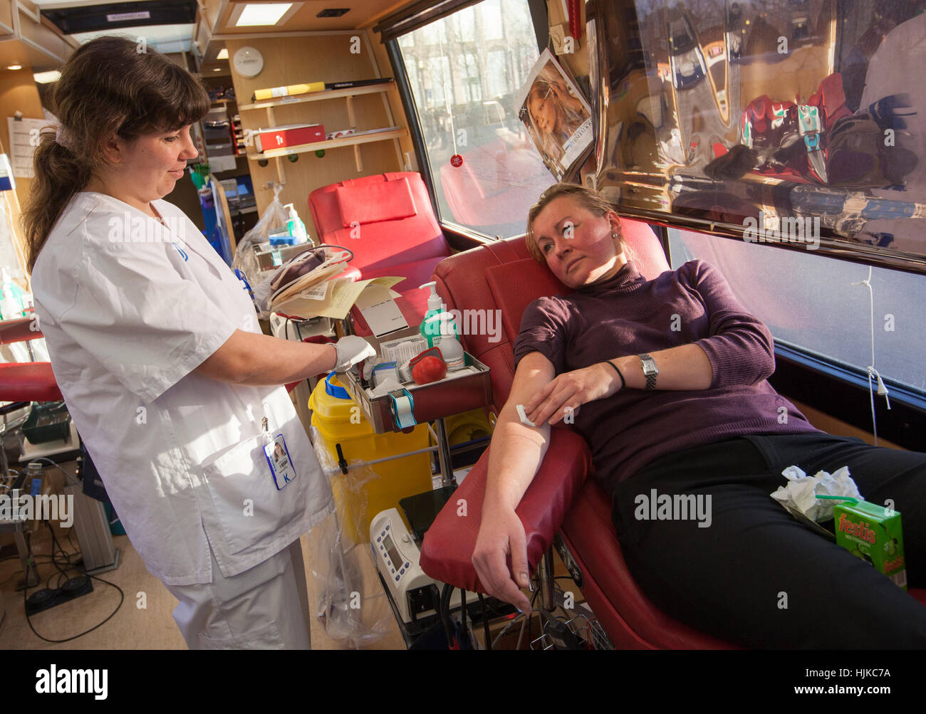 Blood donors visiting the blood bus to donate blood Stock Photo - Alamy
