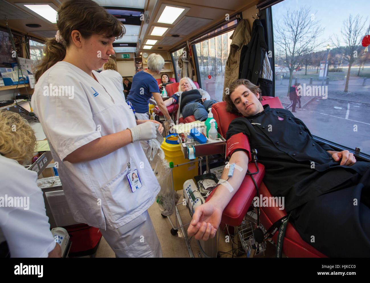 Blood donors visiting the blood bus to donate blood Stock Photo - Alamy