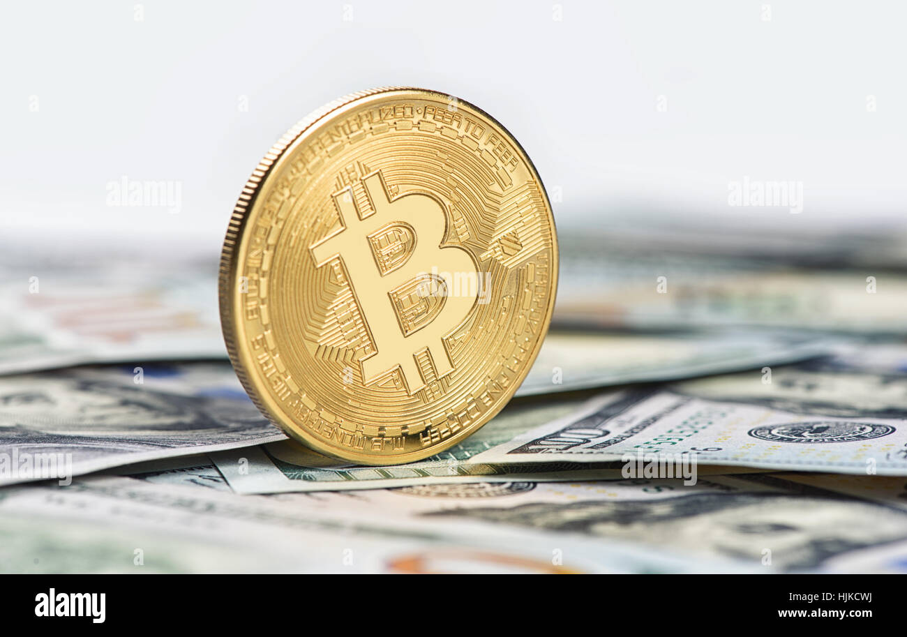 golden bitcoin coin on dollars close up. Cryptocurrency Stock Photo - Alamy