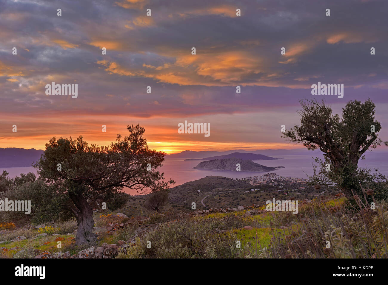 Sunset at Perdika village and Moni islet in the Aegina island located ...