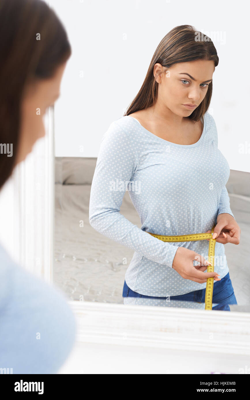 Woman mirror unhappy body hi-res stock photography and images - Alamy