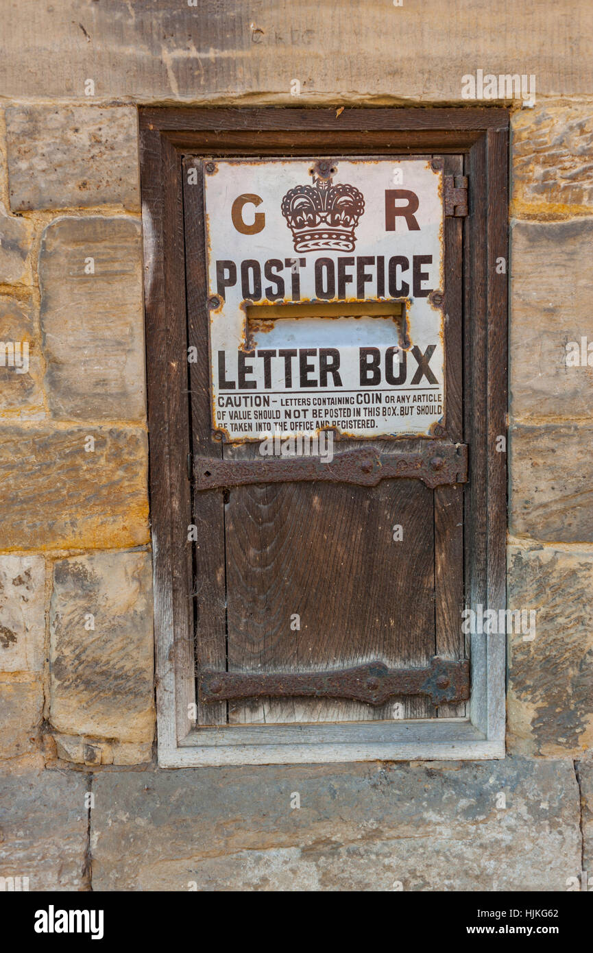 Old wooden post box in the wall of a building in Penshurst kent Stock ...
