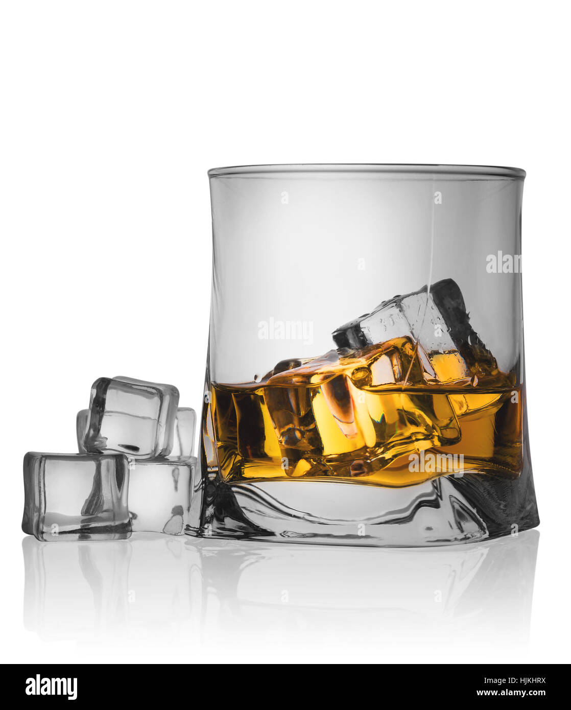 Glass of whiskey with ice and ice cubes isolated on white background ...