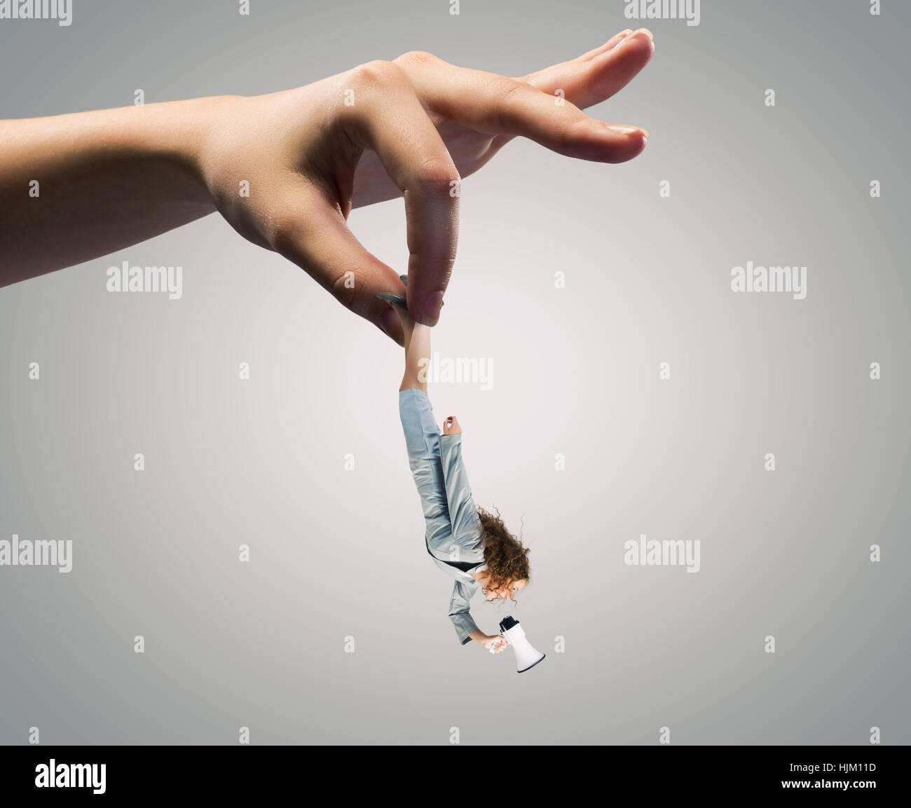 Giant human hand holding miniature hi-res stock photography and images ...